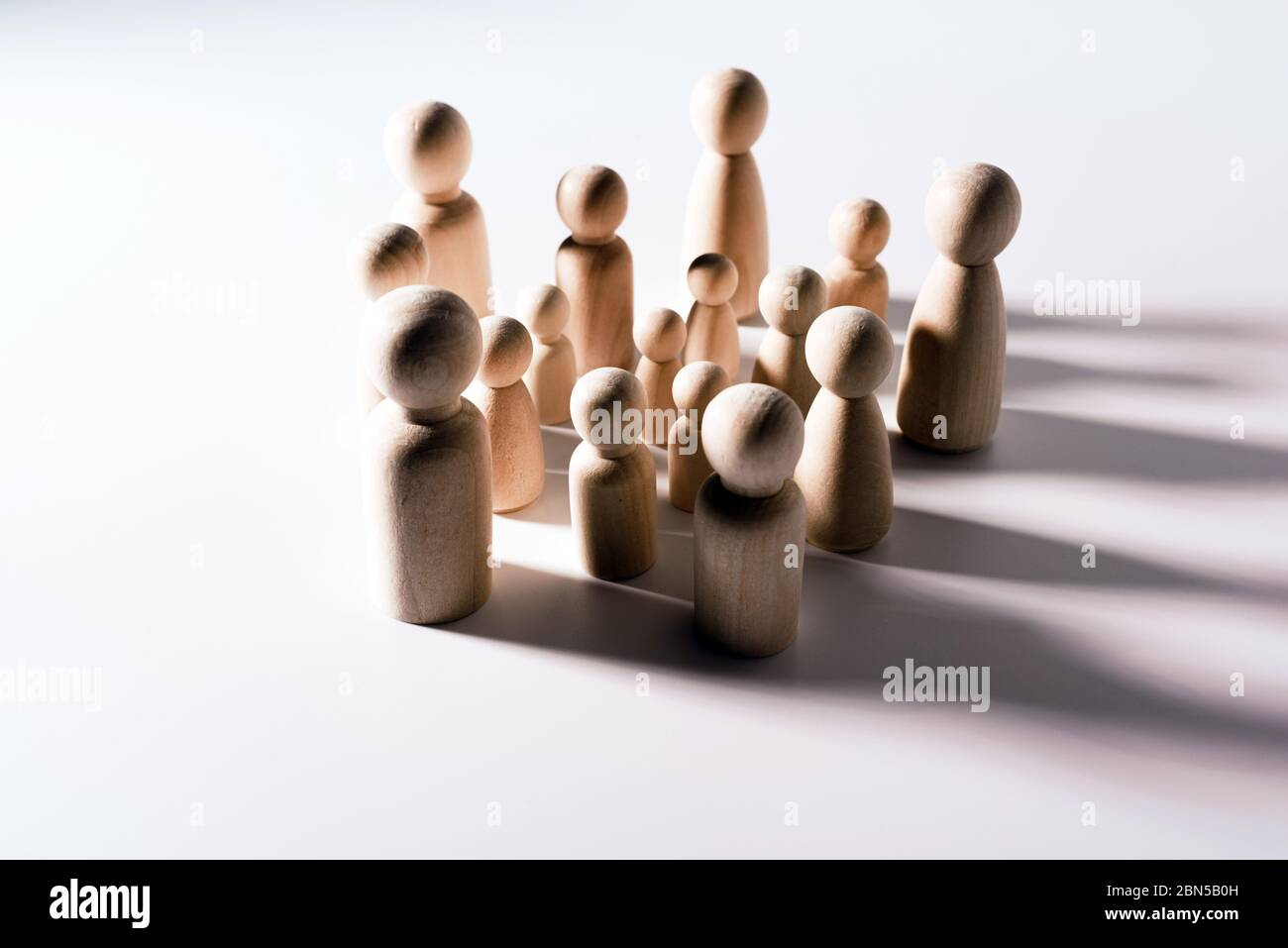 Group of confused grouped people, represented by wooden figures ...