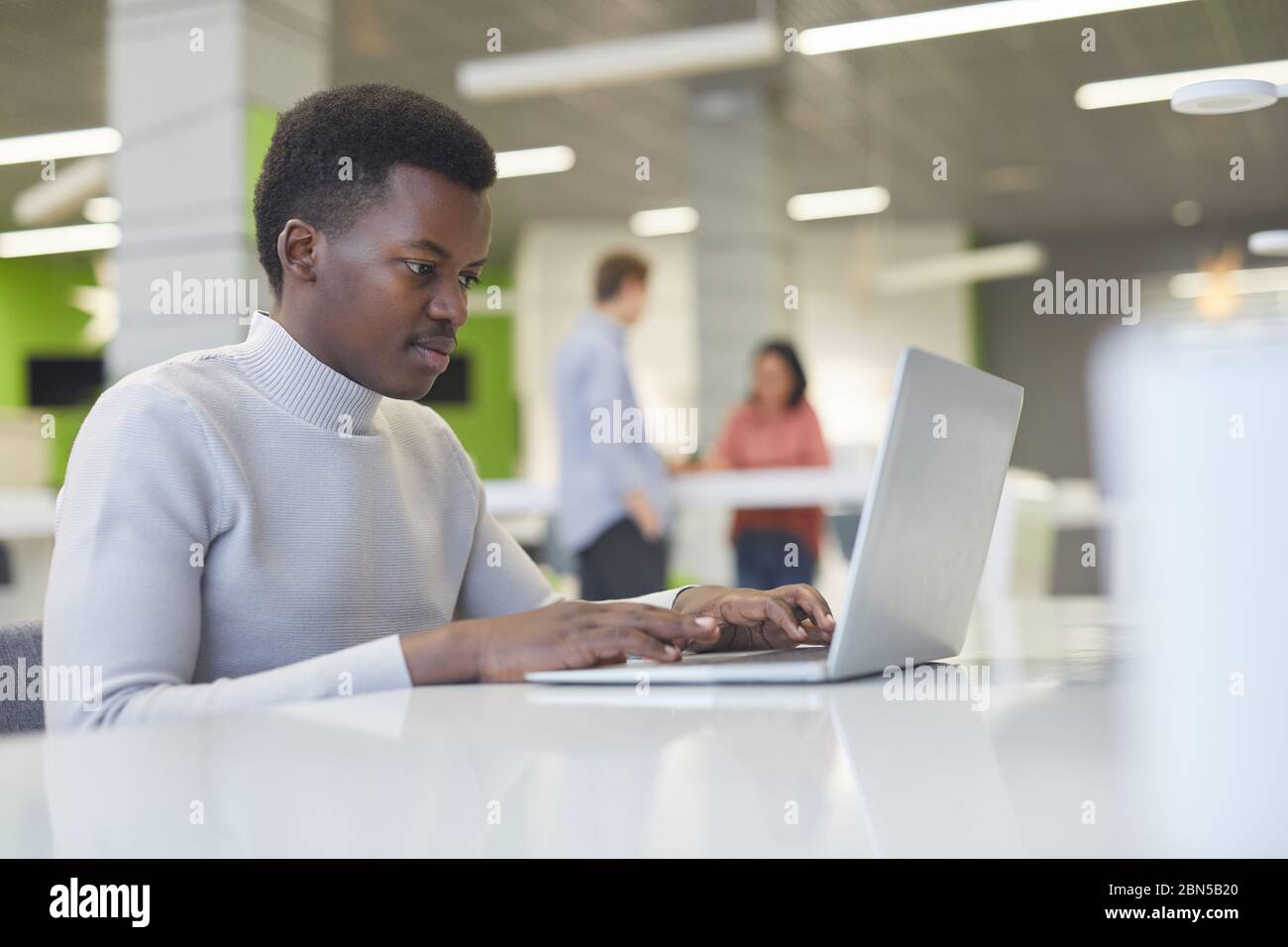 African american young man typing hi-res stock photography and images ...