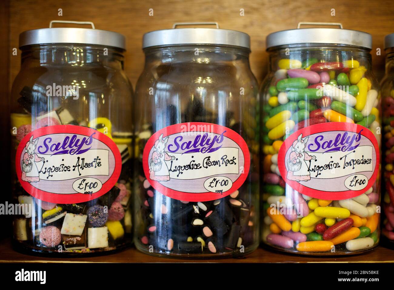 A row of filled sweet Jars in a shop Stock Photo - Alamy