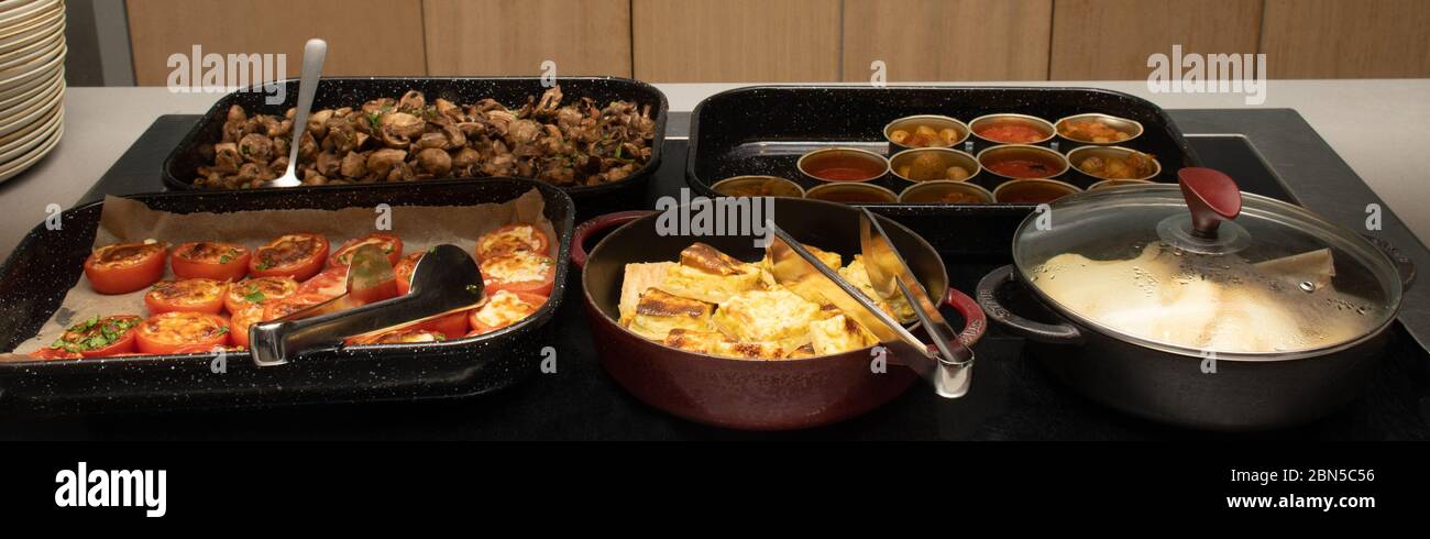 Selection of self service catering continental breakfast buffet display ...