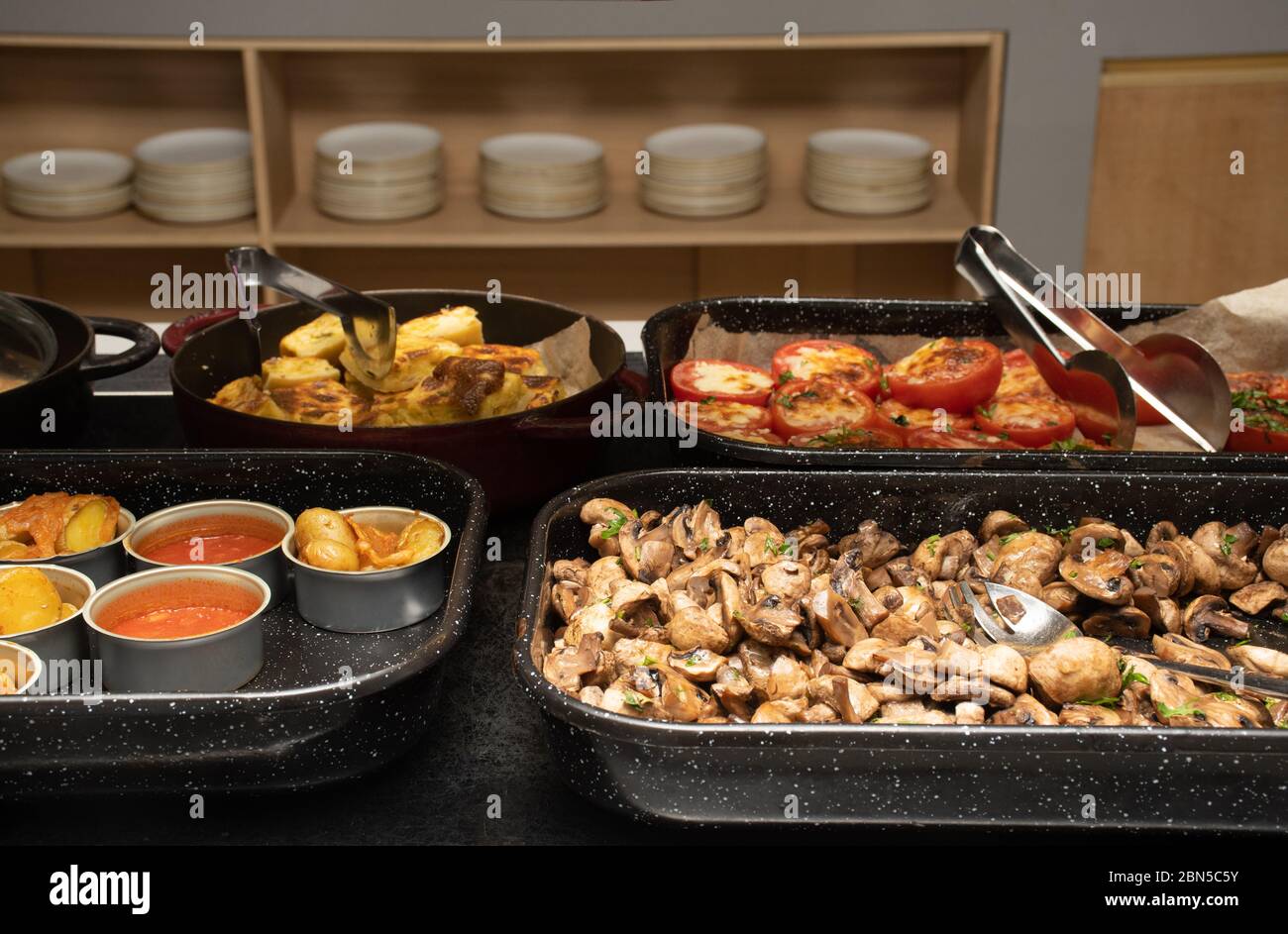 Selection of self service catering continental breakfast buffet display ...