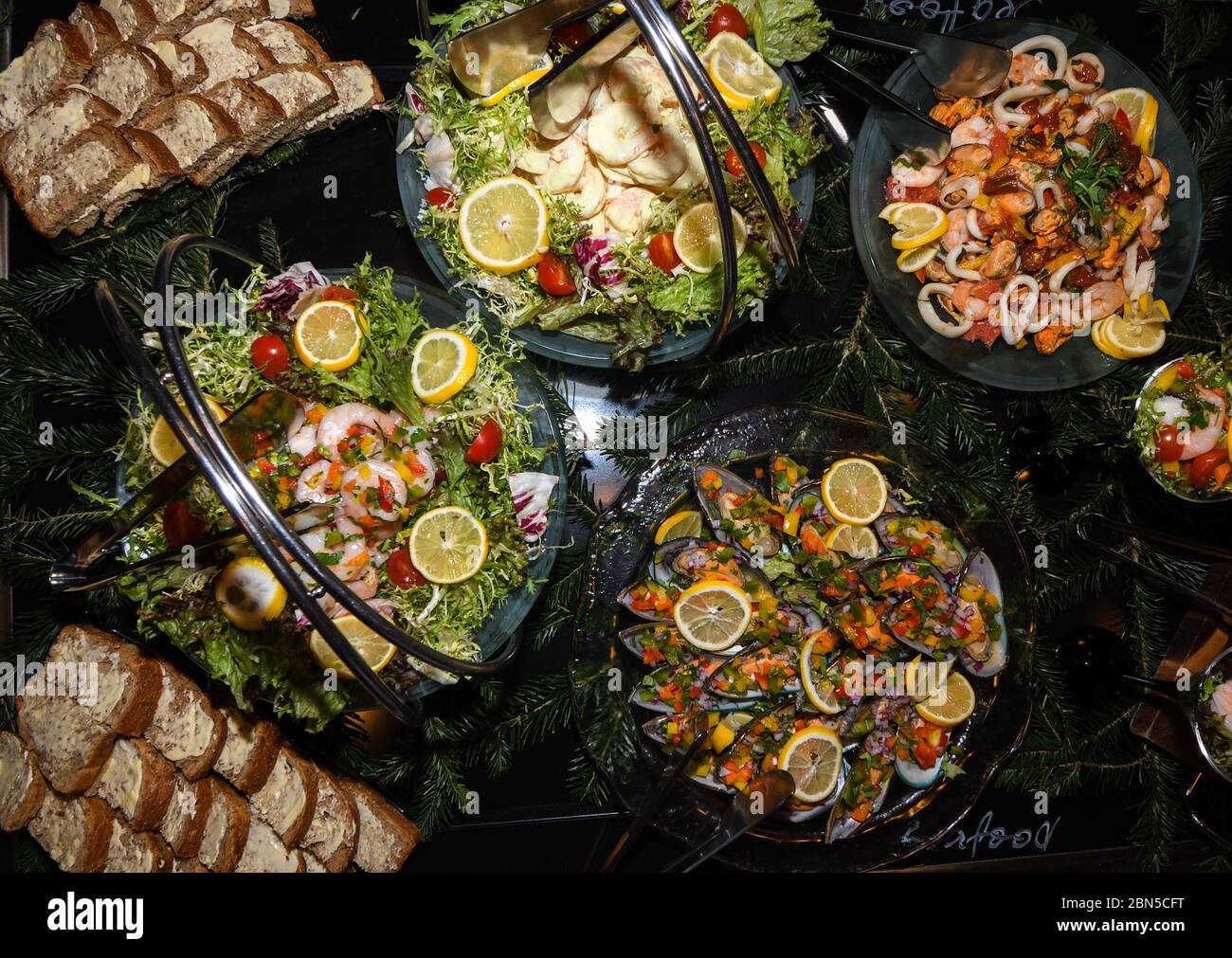 Marinated shrimp cocktail, mussels, salad vegetables during hotel ...