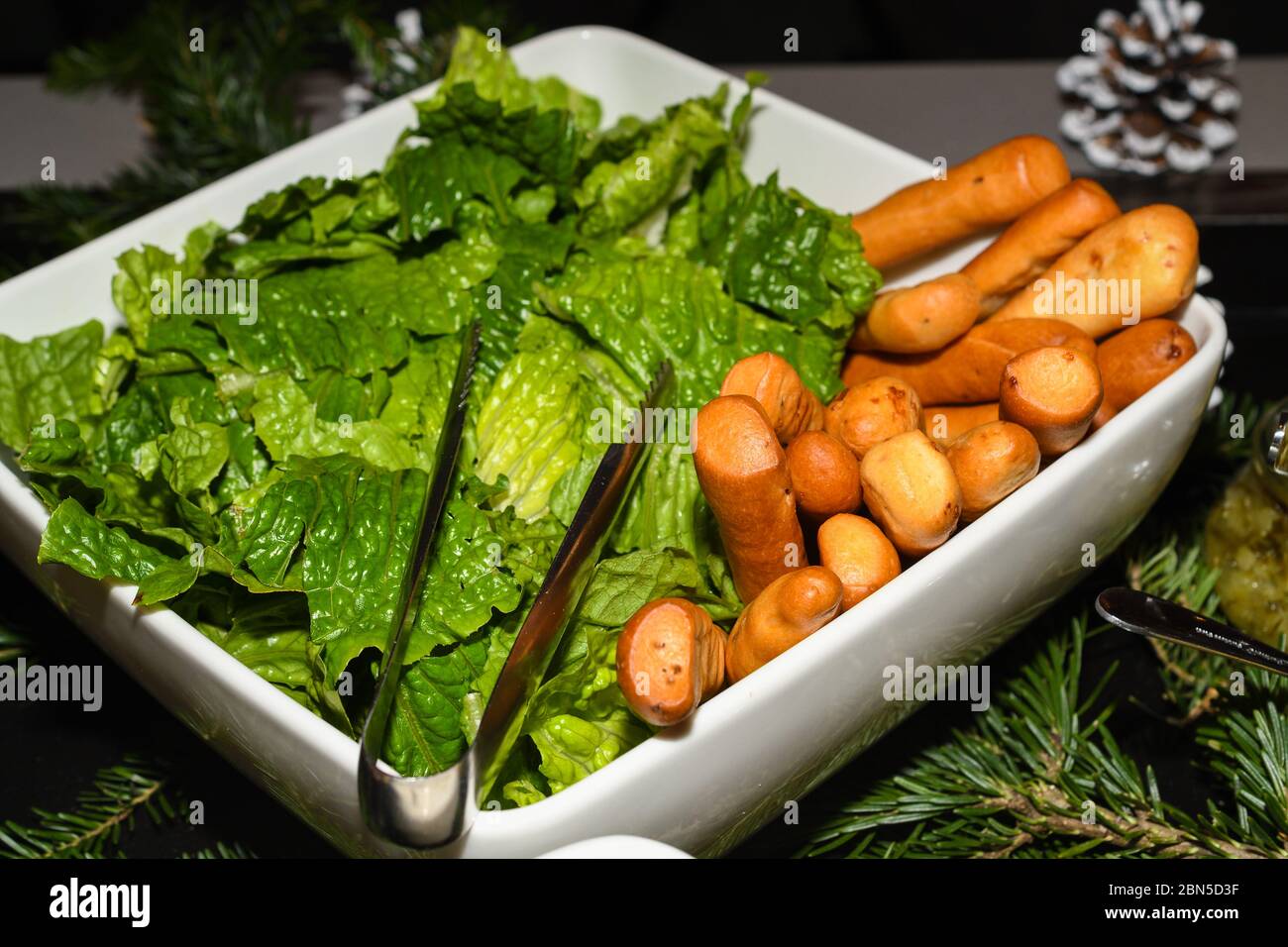 Simple salad lettuce bowl no dressing, served during brunch buffet in ...