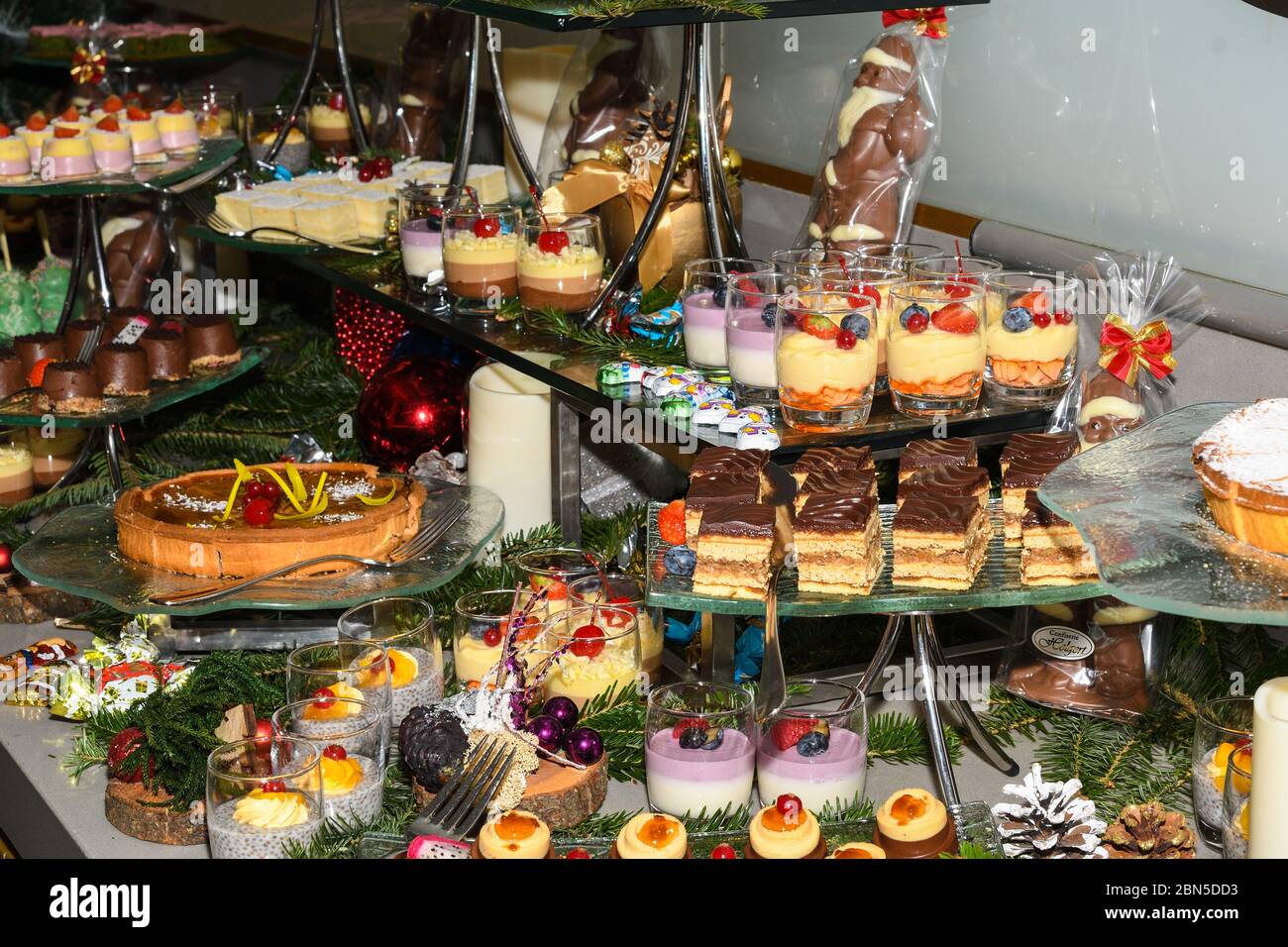 Various desserts in candy bar food buffet during hotel brunch, catering ...