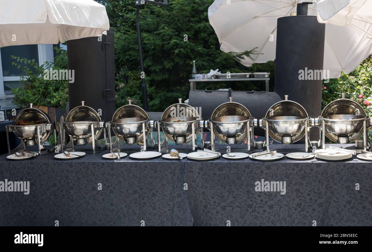 Live food stations. Kitchenware in the line catering summer brunch ...