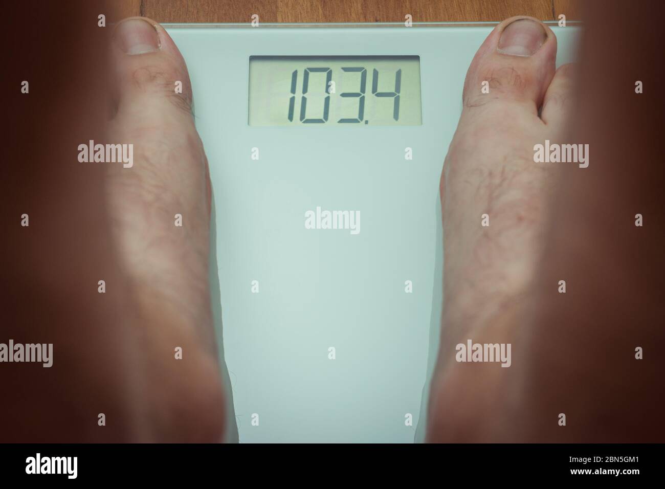 Person on scales hi-res stock photography and images - Alamy