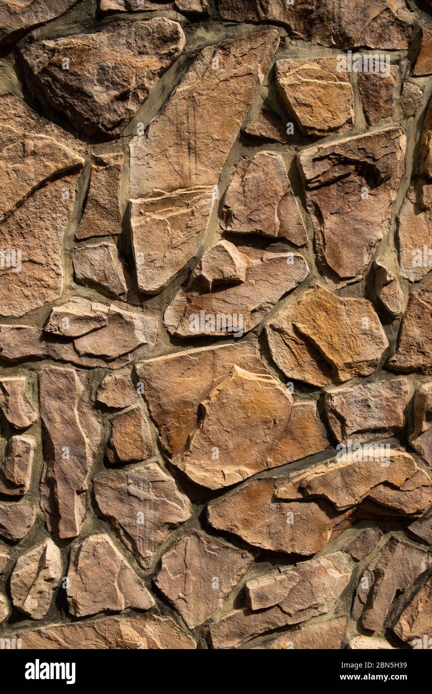 Brown stone wall texture background Stock Photo - Alamy