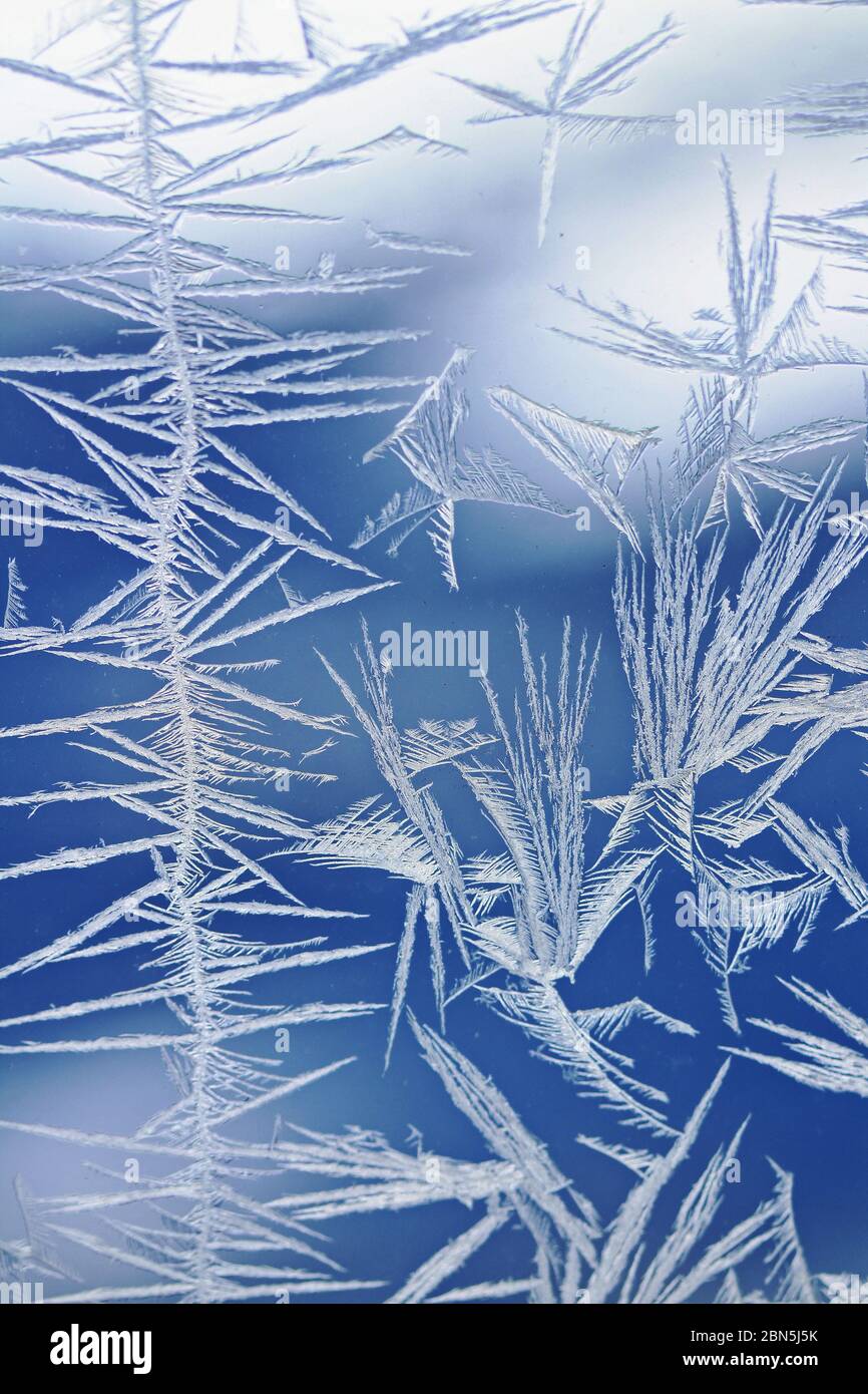 Ice formation on a window during the winter season Stock Photo - Alamy