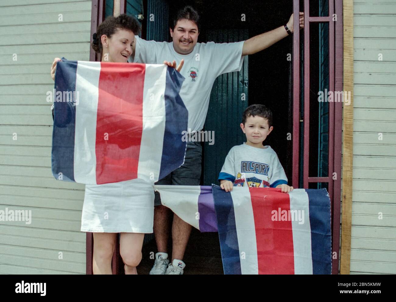 Costa Rican family outside their house Stock Photo - Alamy