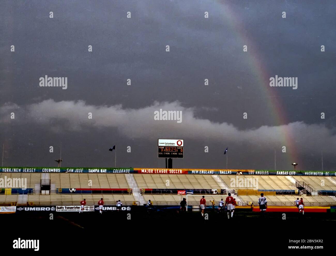 Rainbow over a soccer stadium Stock Photo - Alamy
