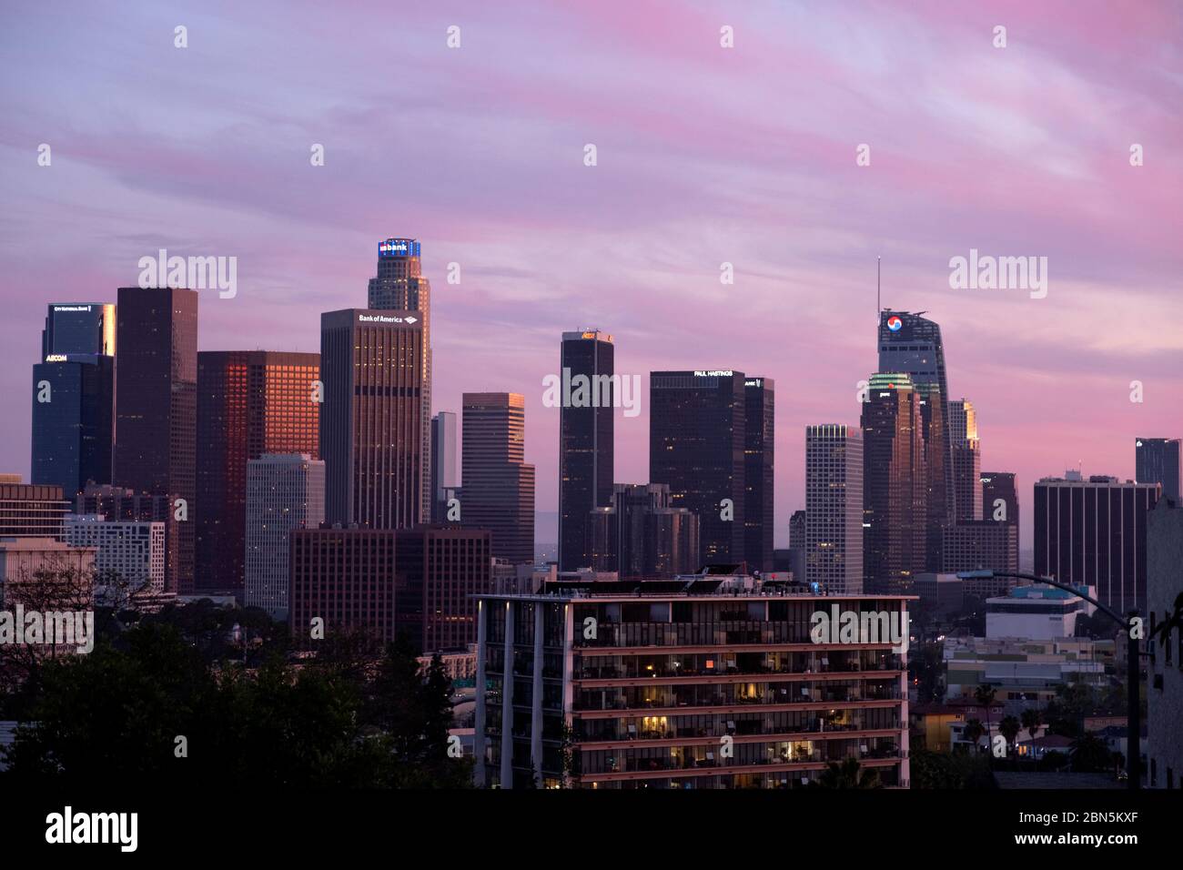 Downtown Los Angeles skyline under a pink sunset sky Stock Photo - Alamy