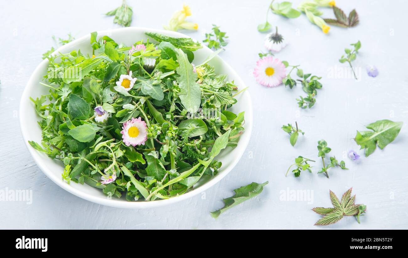 Mixed salad leaves with edible flowers. Healthy food concept. Image ...