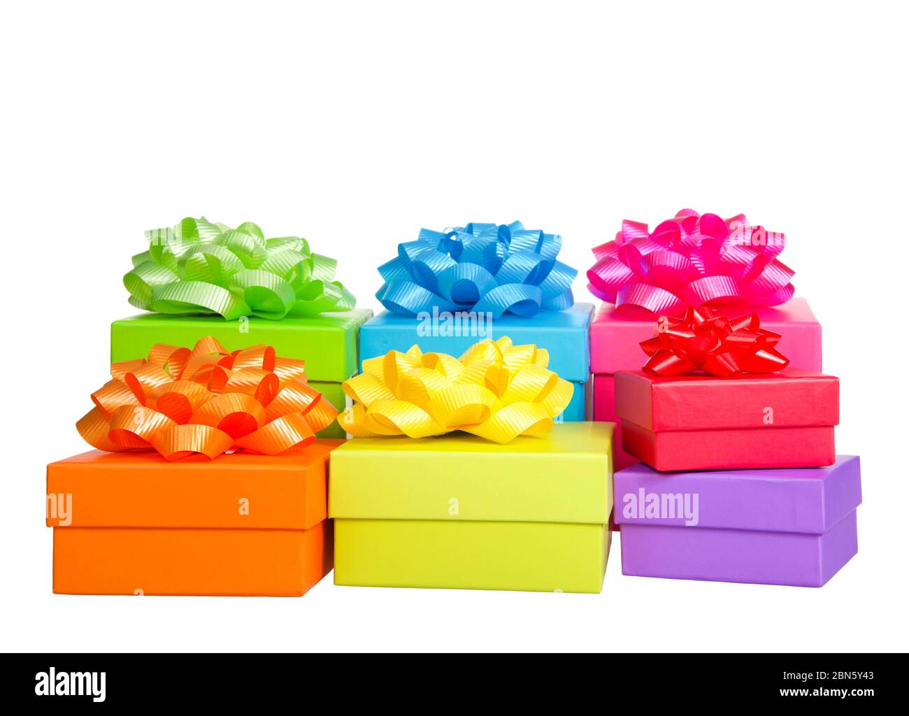 Piles of small colorful bright holiday presents with ribbons and bows ...