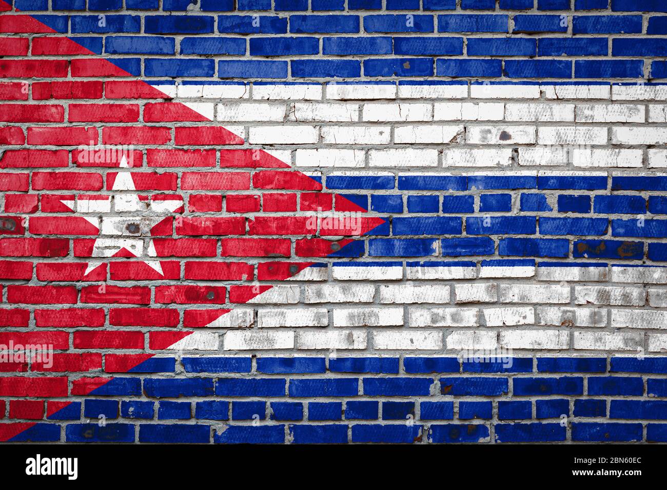 National flag of Cuba depicting in paint colors on an old brick wall ...