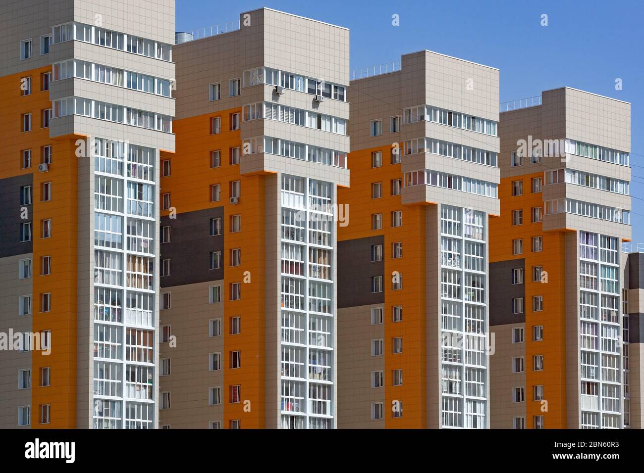 New multi-storey buildings in a row. Concept of housing construction ...