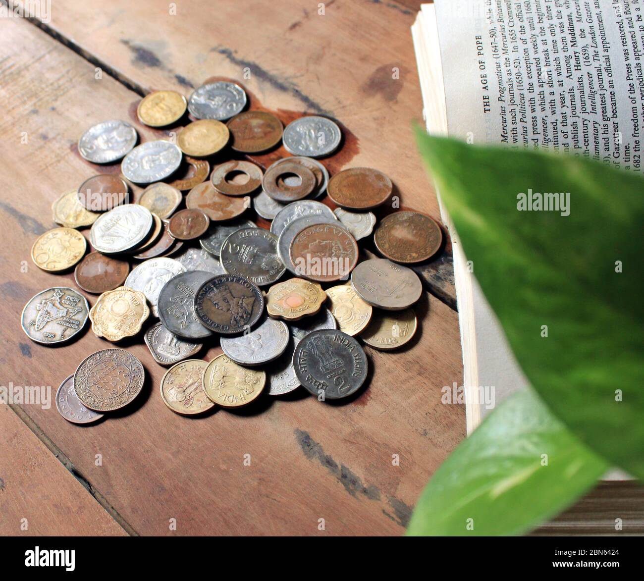 An old antique Indian paise coins in front of book. Old Indian vintage ...