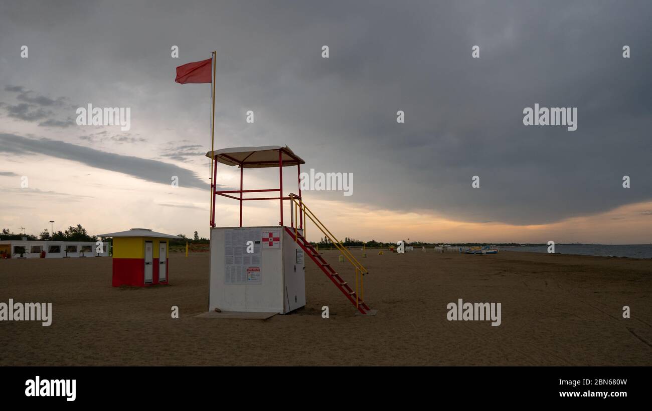A red and yellow dangerous swimming warning lifeguard flag Stock Photo ...