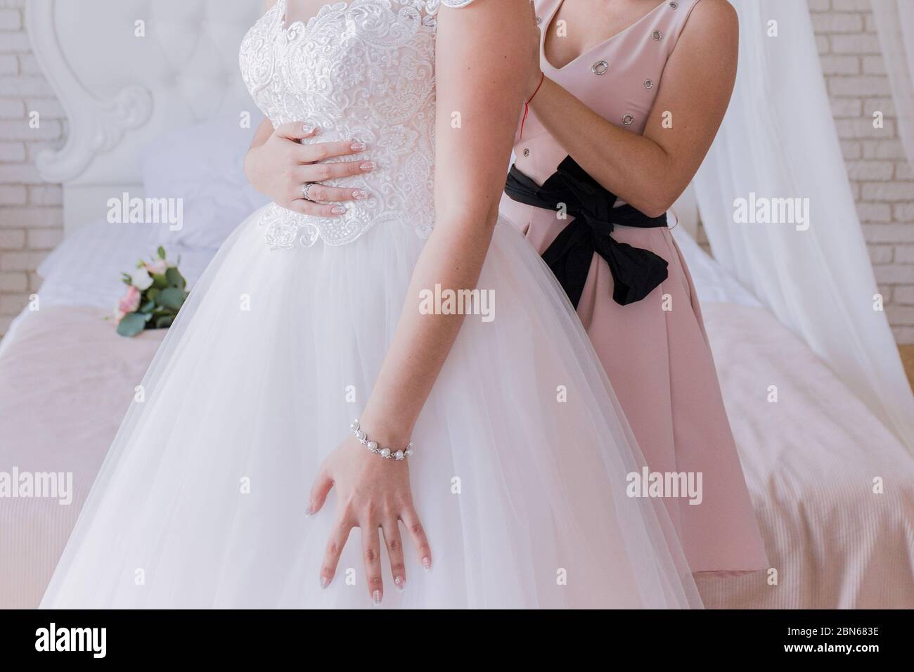 the bride wears a wedding dress Stock Photo - Alamy