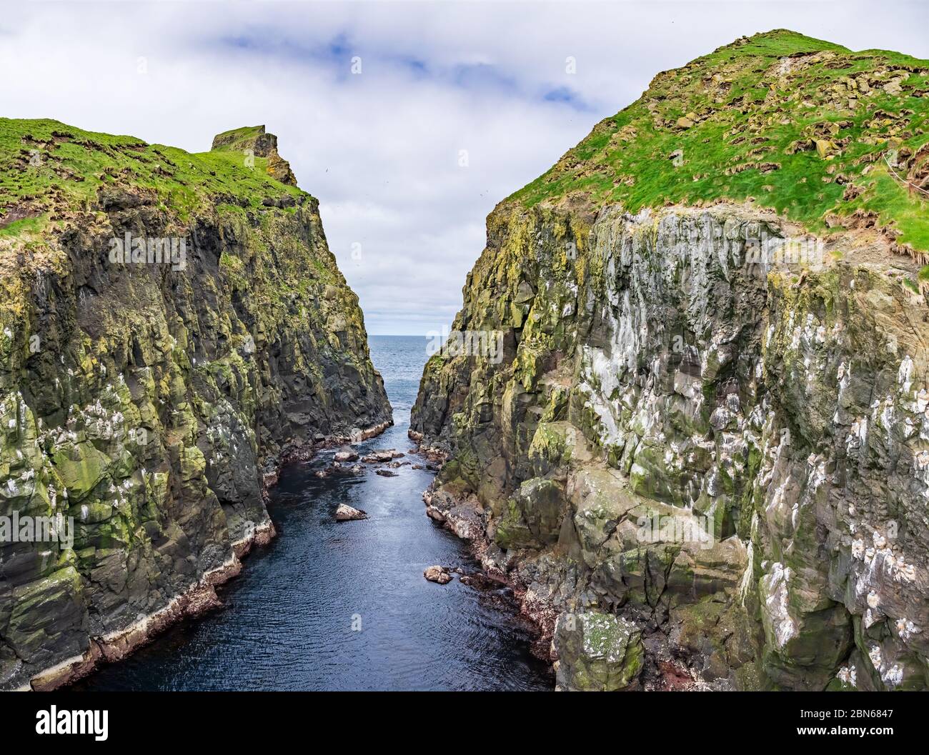 Narrow space of ocean between two islets Stock Photo - Alamy