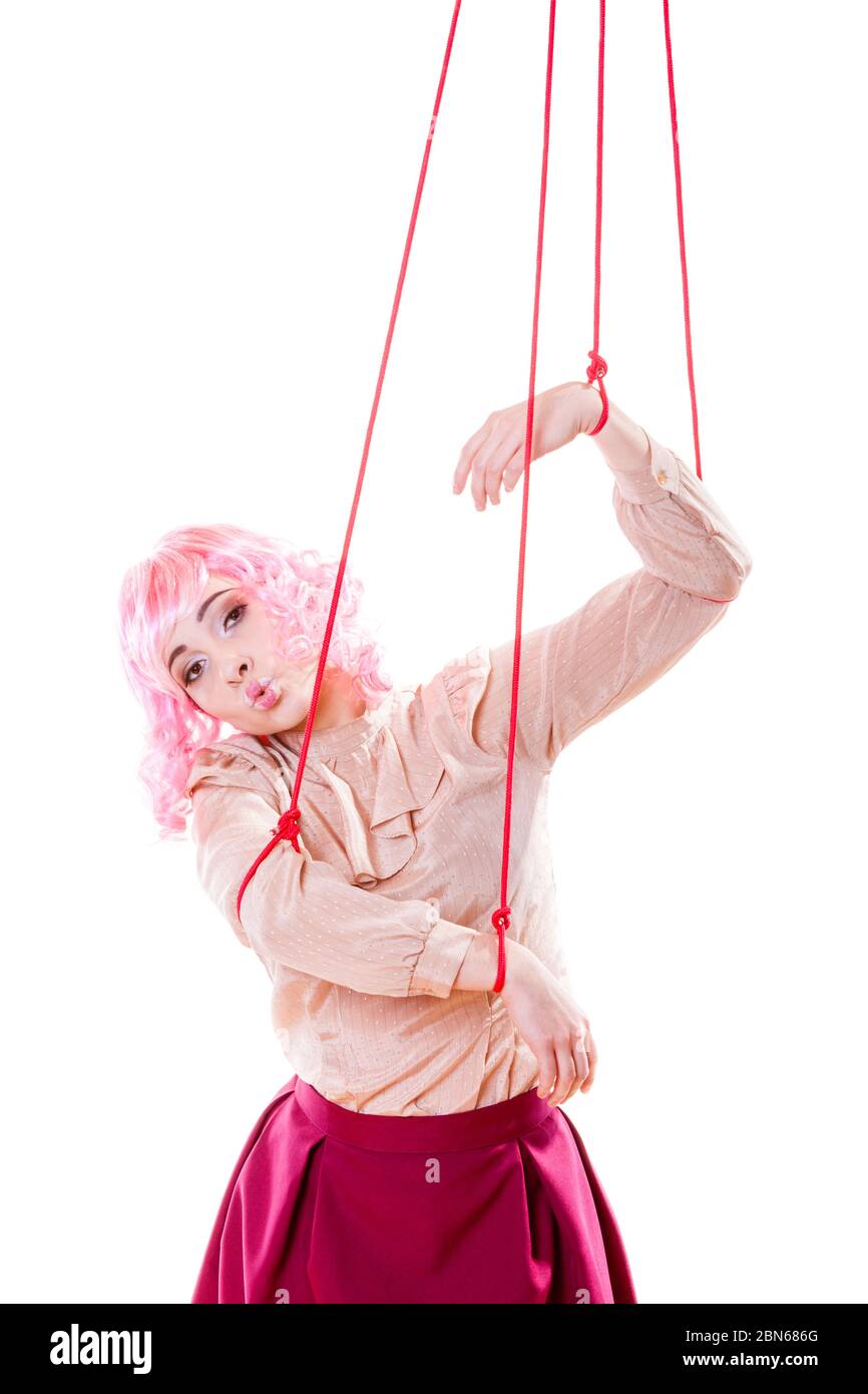 Young woman girl stylized like marionette puppet on string Stock Photo ...