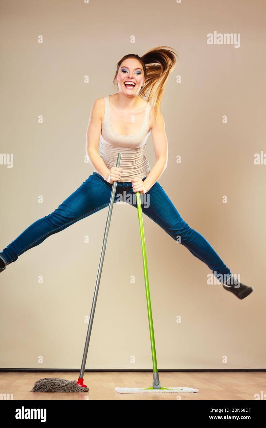 Cleanup housework concept. Funny cleaning lady young woman mopping ...