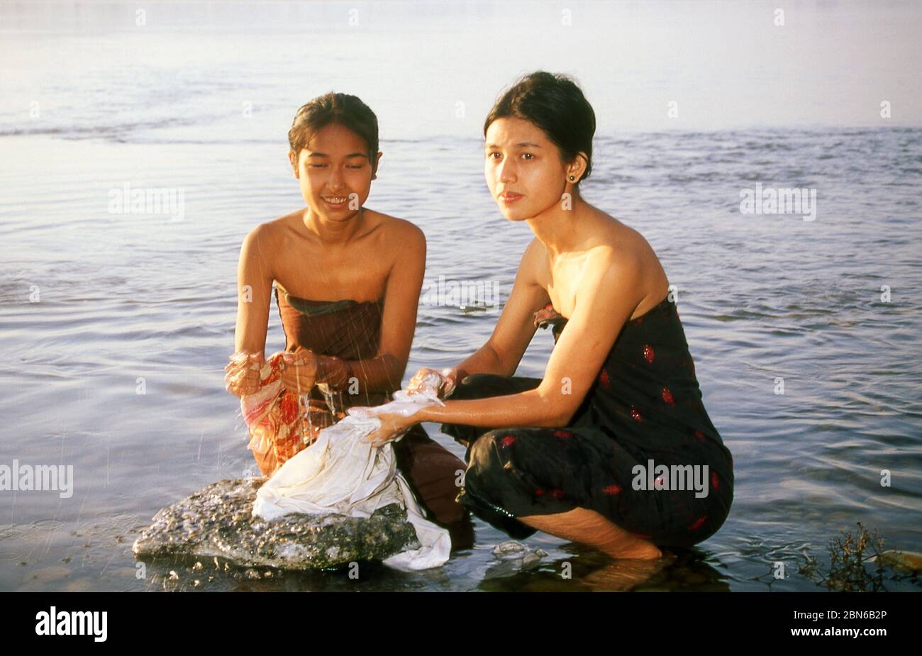 Burma / Myanmar: Burmese women washing clothes in the Ayeyarwady ...