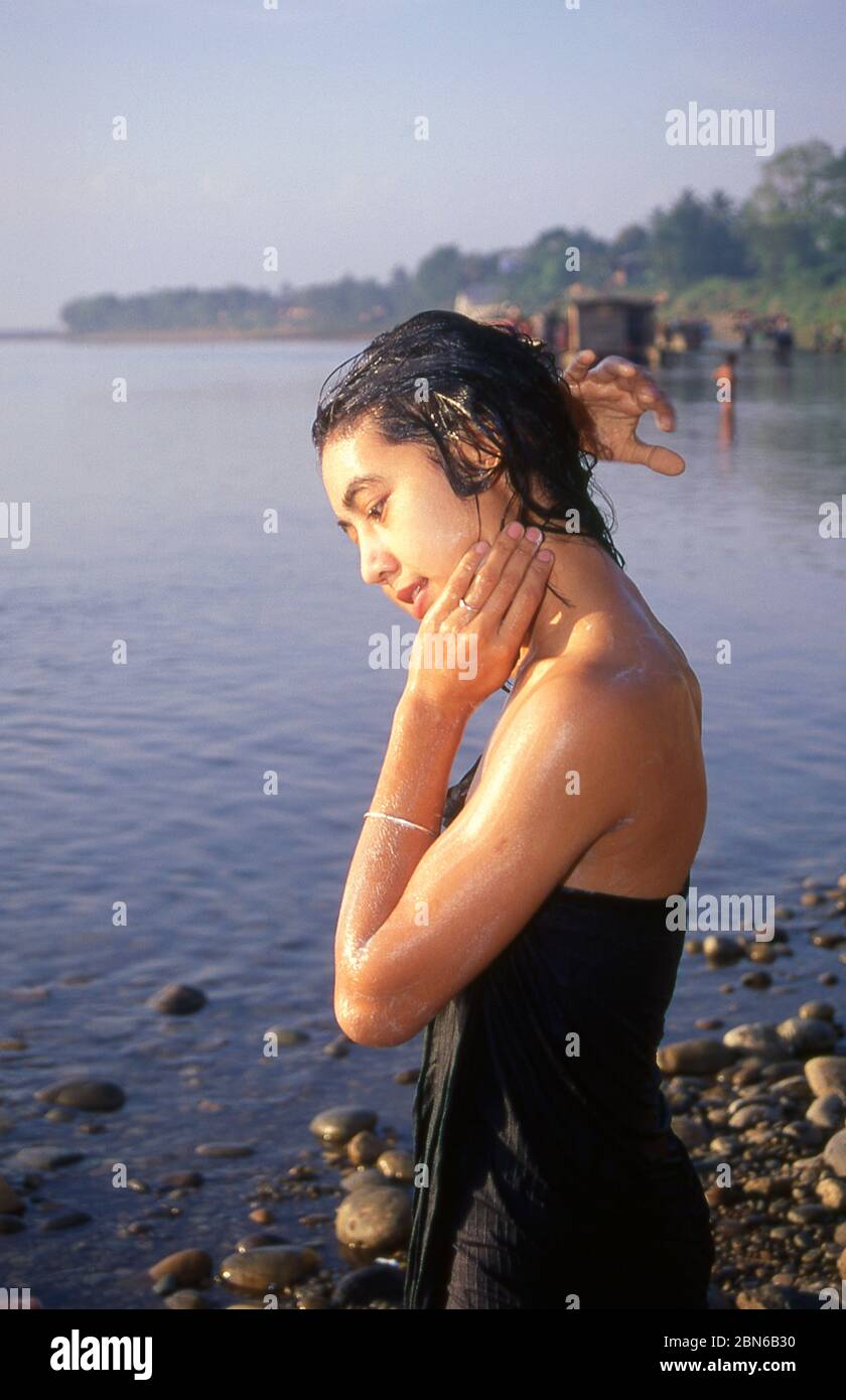Burma / Myanmar: A Burmese woman bathing in the Ayeyarwady (Irrawaddy ...