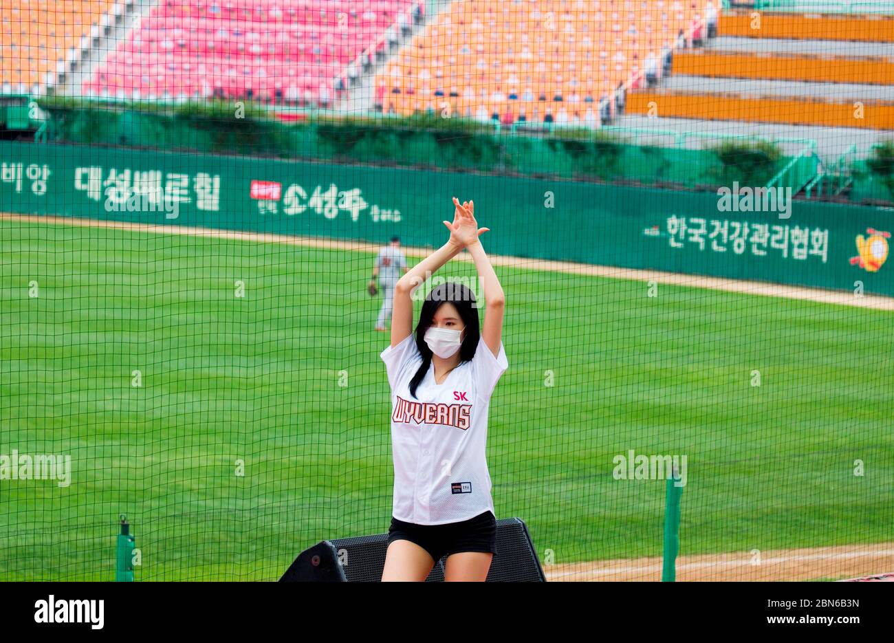 A member of SK Wyverns' cheering squad wearing a mask to prevent COVID-19 infection, May 5, 2020 ...