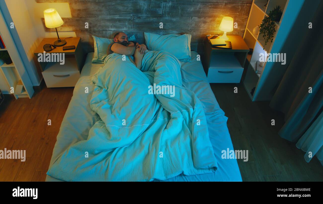 Man and woman under sheet hi-res stock photography and images - Alamy