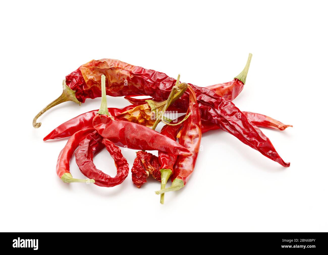Heap of dried red hot chilli peppers on white background Stock Photo ...