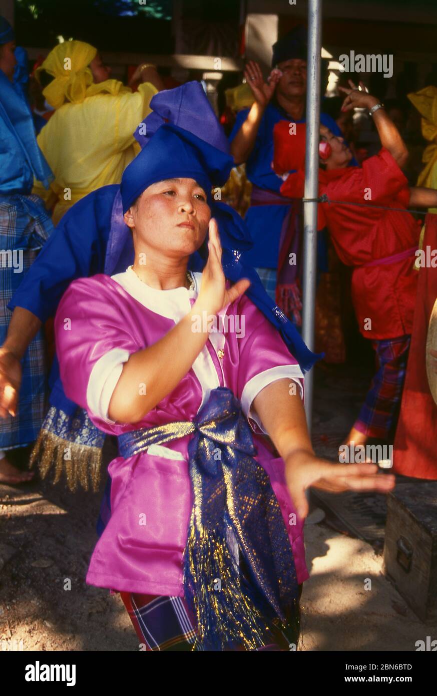 Thailand: Brightly dressed spirit medium (ngan phi) at a Thai New Year ...
