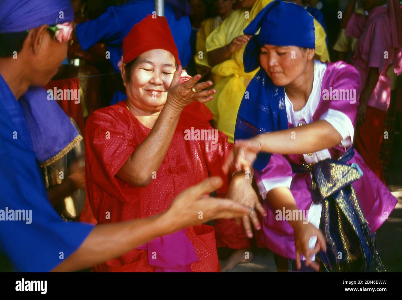 Thailand: Brightly dressed spirit medium (ngan phi) at a Thai New Year ...