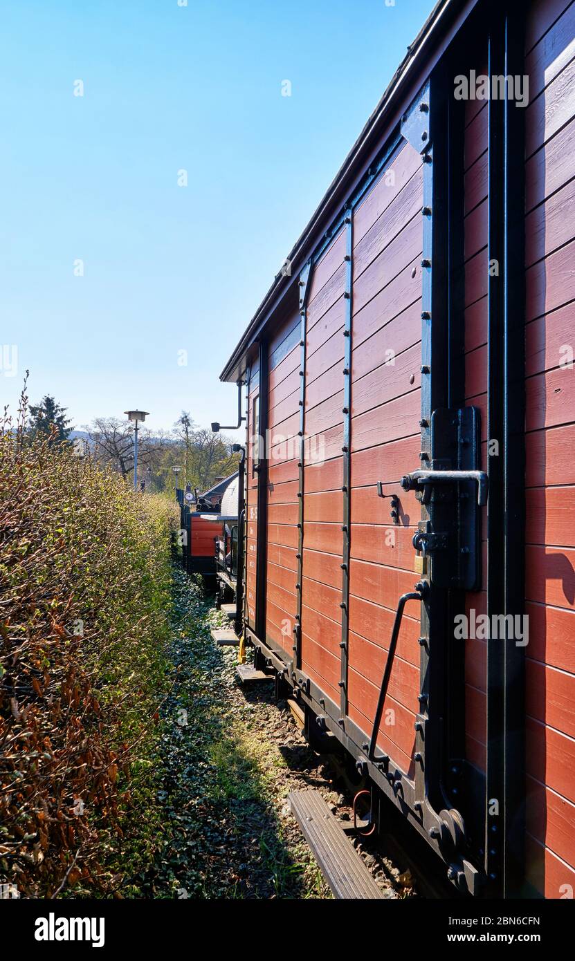 Red wood wagon of the steam locomotive at the train station Stock Photo ...
