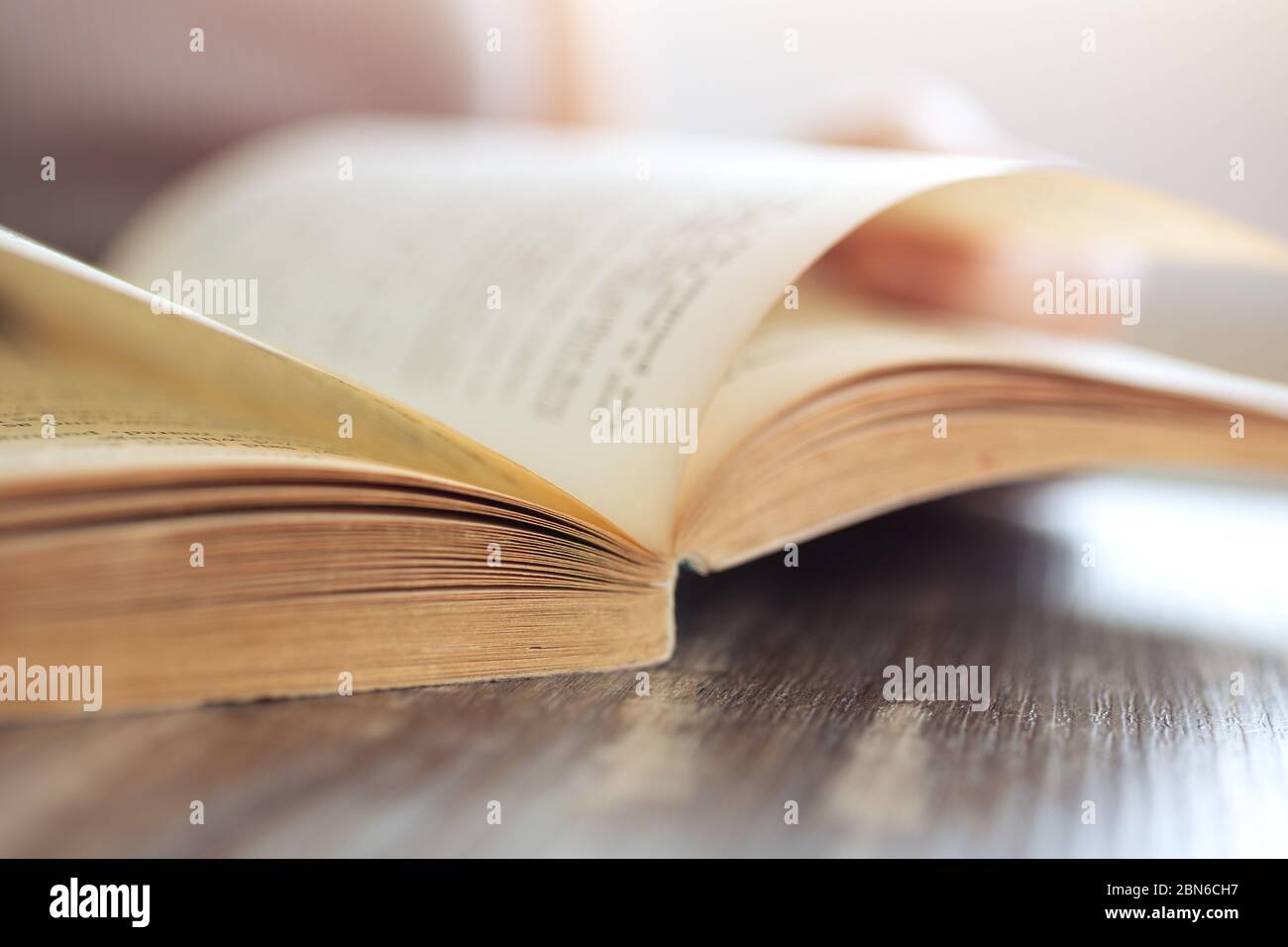 Vintage close up of an old open book with yellow pages. Avid reader ...