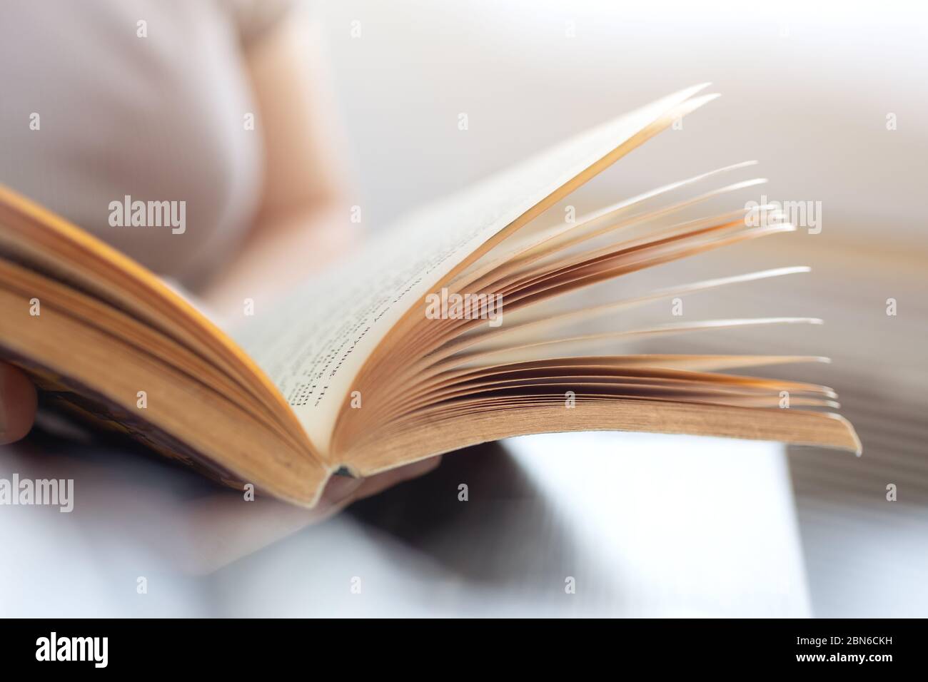 Vintage close up of an old open book with yellow pages. Avid reader ...