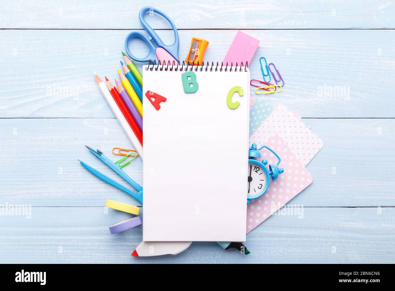 Back to school concept, with colorful stationery for kids on blue ...