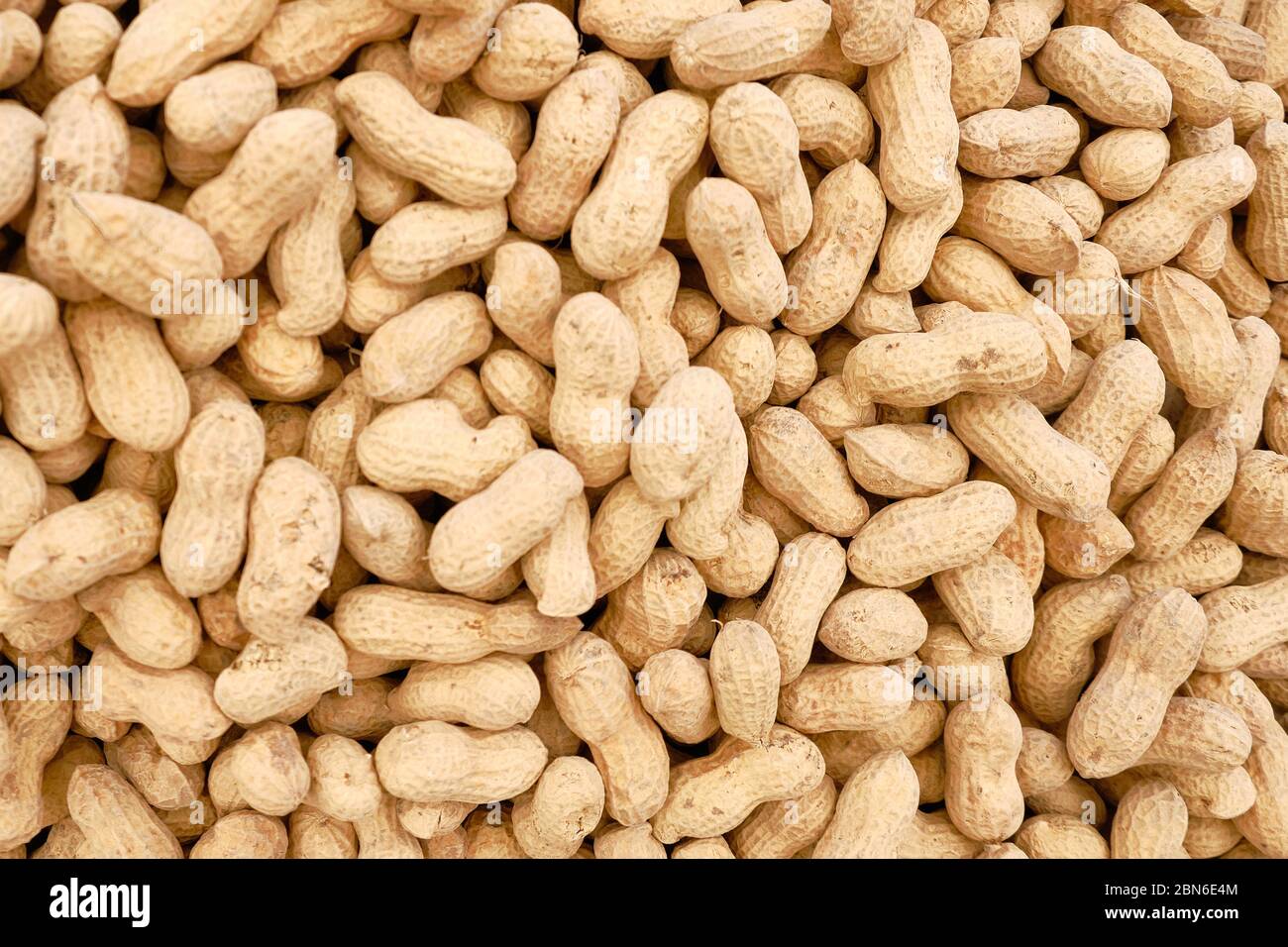peanuts in the shell background or texture Stock Photo - Alamy