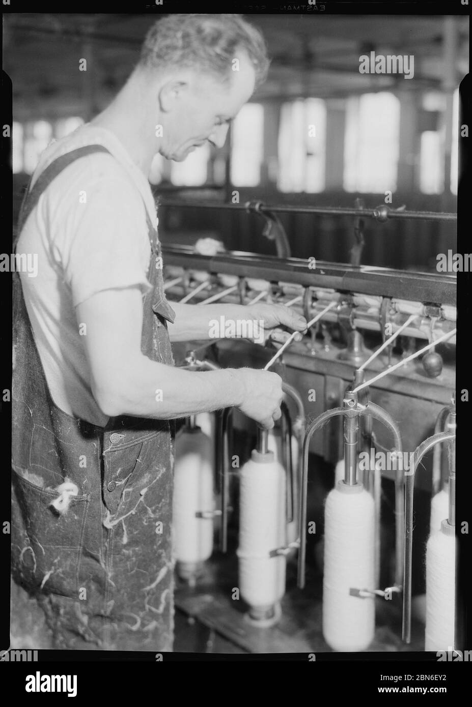 Textiles. Pacific Mills. Piecing-up on slubber frame (Front view ...