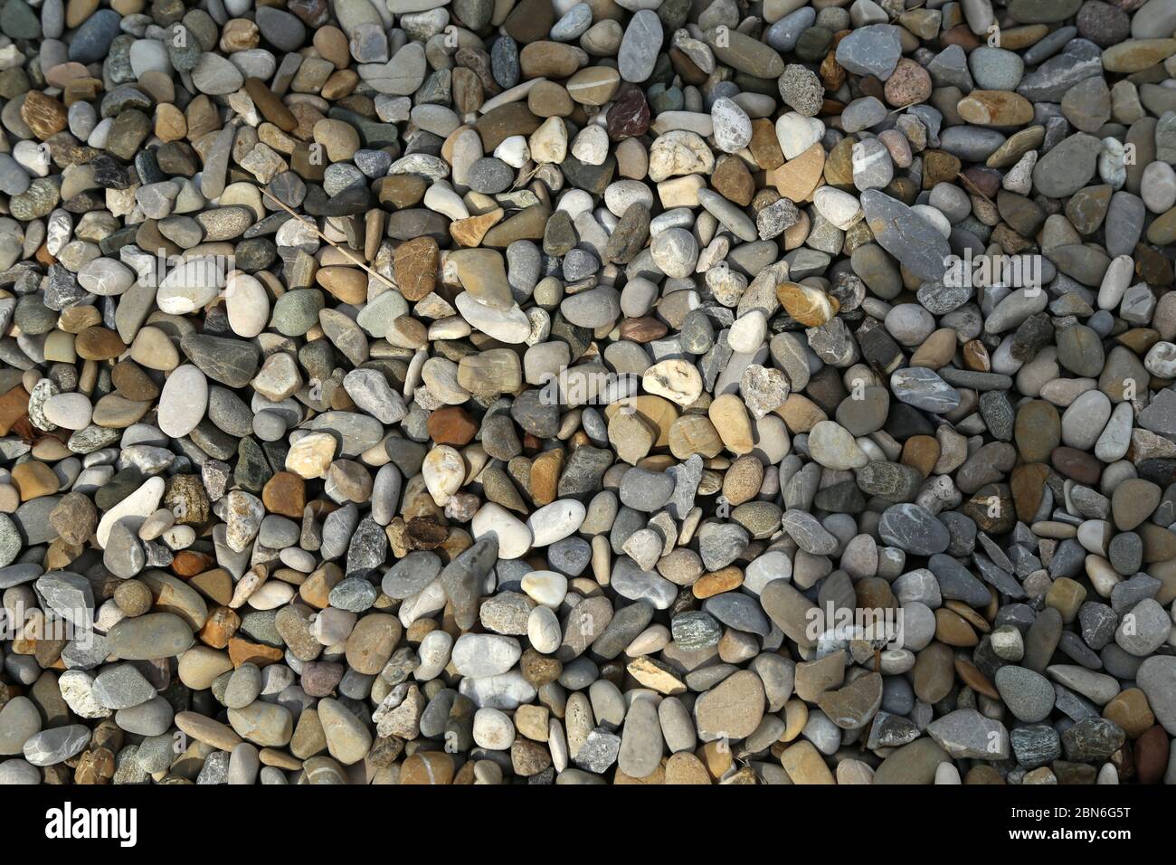 Abstract background with dry round Round river pebbles Stock Photo - Alamy