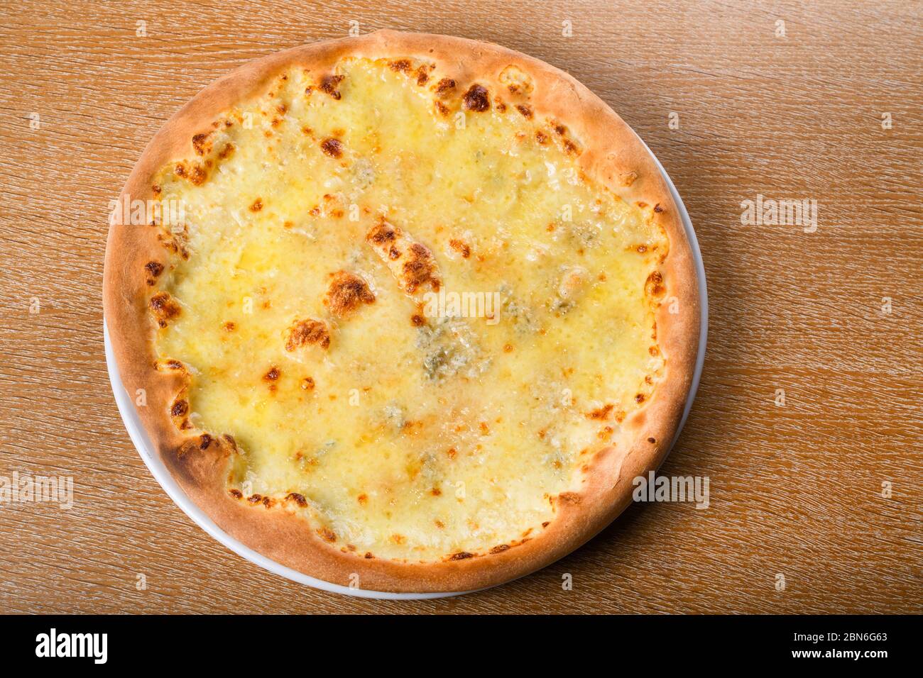 Quattro formaggi is a variety of Italian pizza topped with a ...