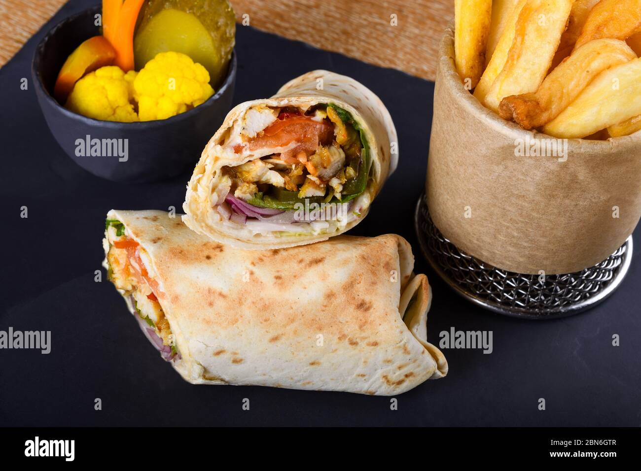 Shawarma dish in Middle Eastern cuisine meat cut into thin slices ...