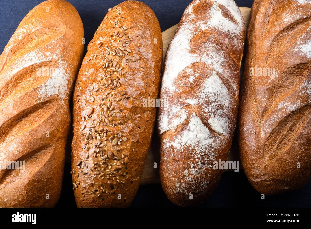 Many mixed breads and rolls shot from above. Top view of assortment of ...