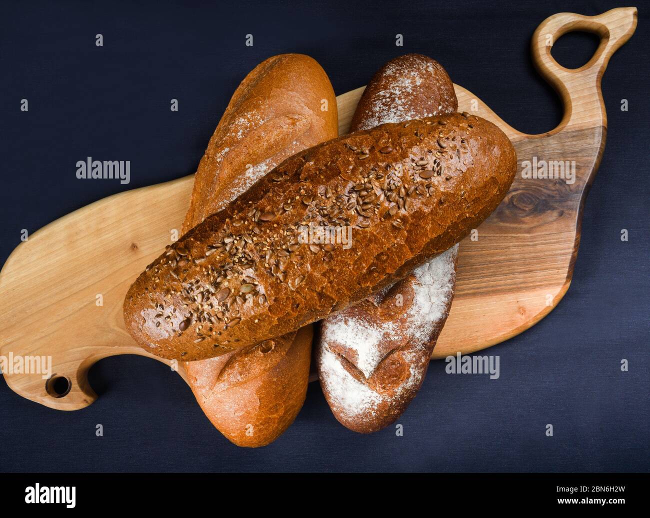 Many mixed breads and rolls shot from above. Top view of assortment of ...