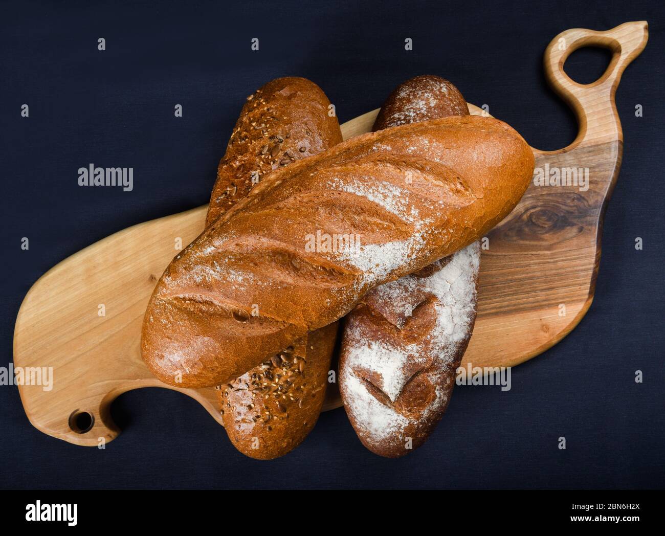 Many mixed breads and rolls shot from above. Top view of assortment of ...