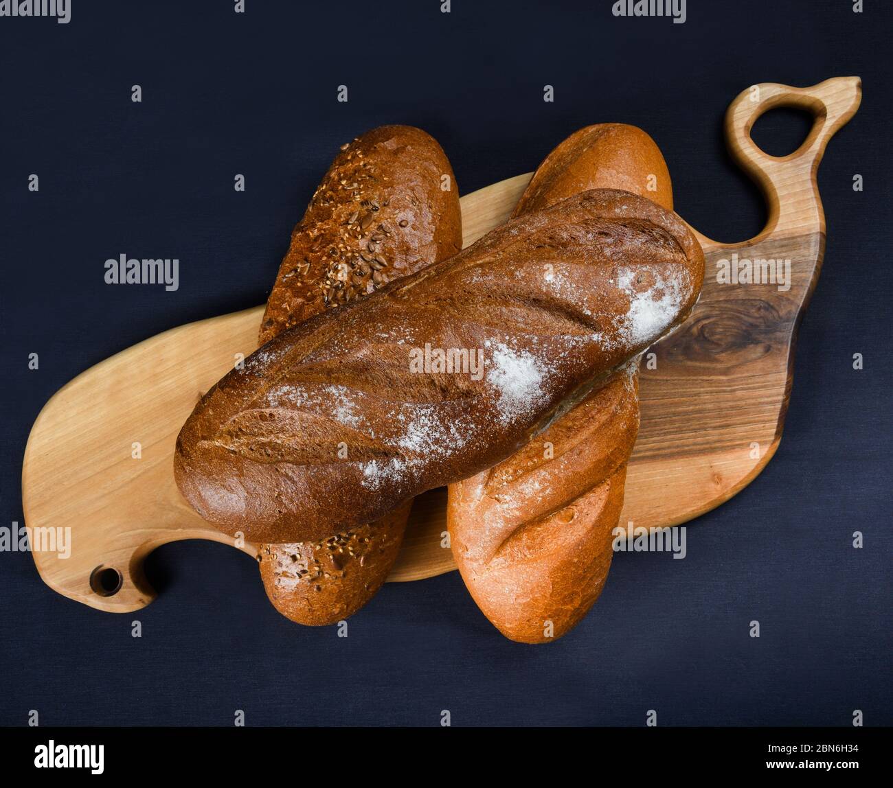 Many mixed breads and rolls shot from above. Top view of assortment of ...