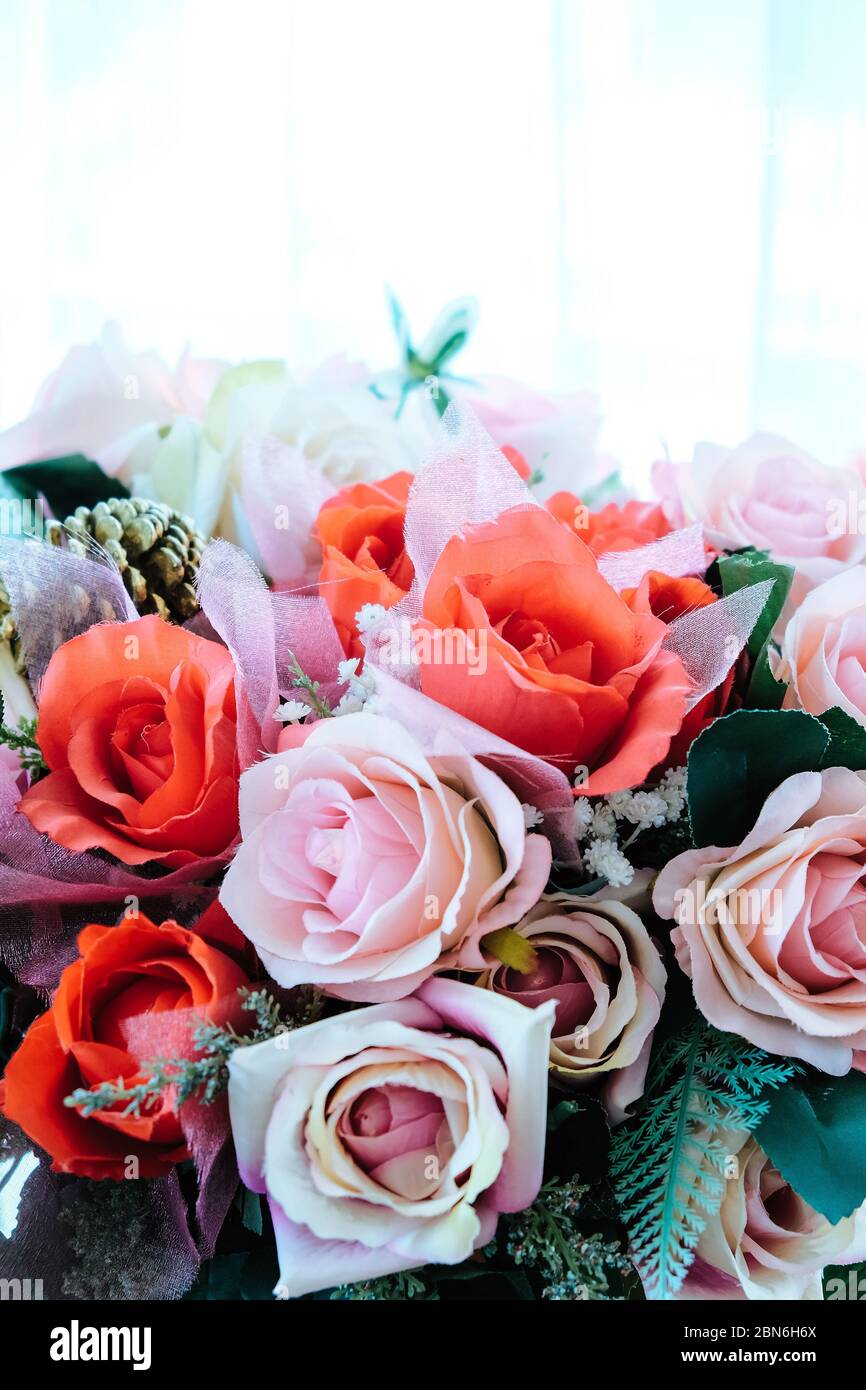 Floral background. artificial flowers in a colorful Stock Photo - Alamy