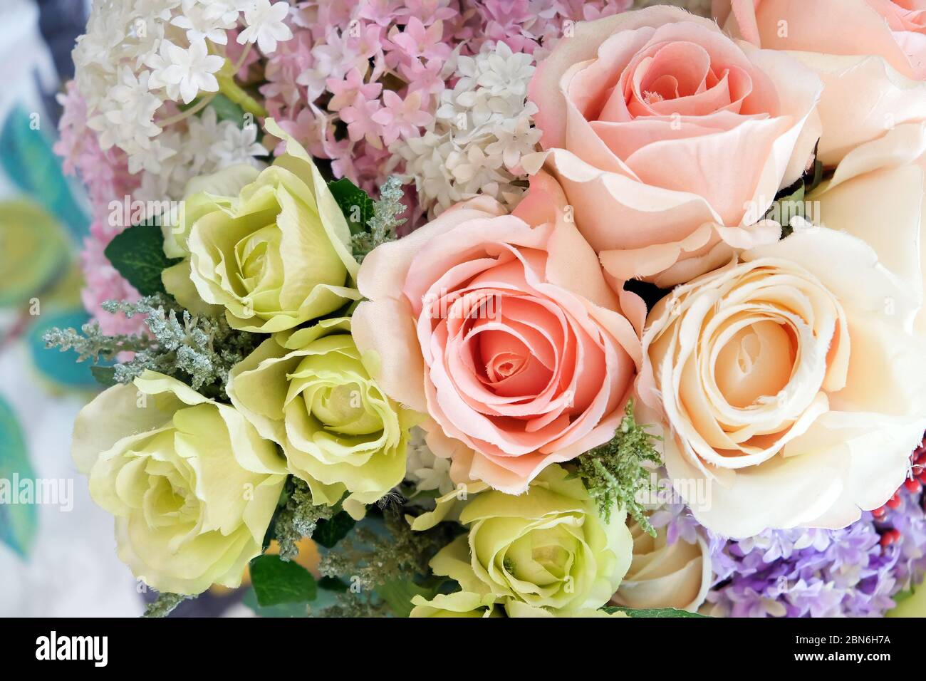 Floral background. artificial flowers in a colorful Stock Photo - Alamy