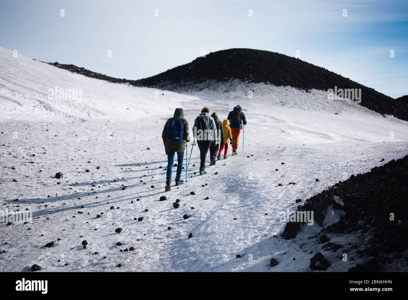 Family walking on the snowy Etna volcano mountain Stock Photo - Alamy