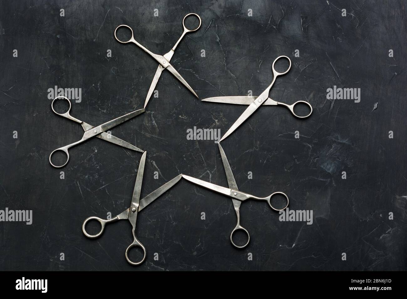 Old scissors on dark background with copy space. Minimal black Stock ...