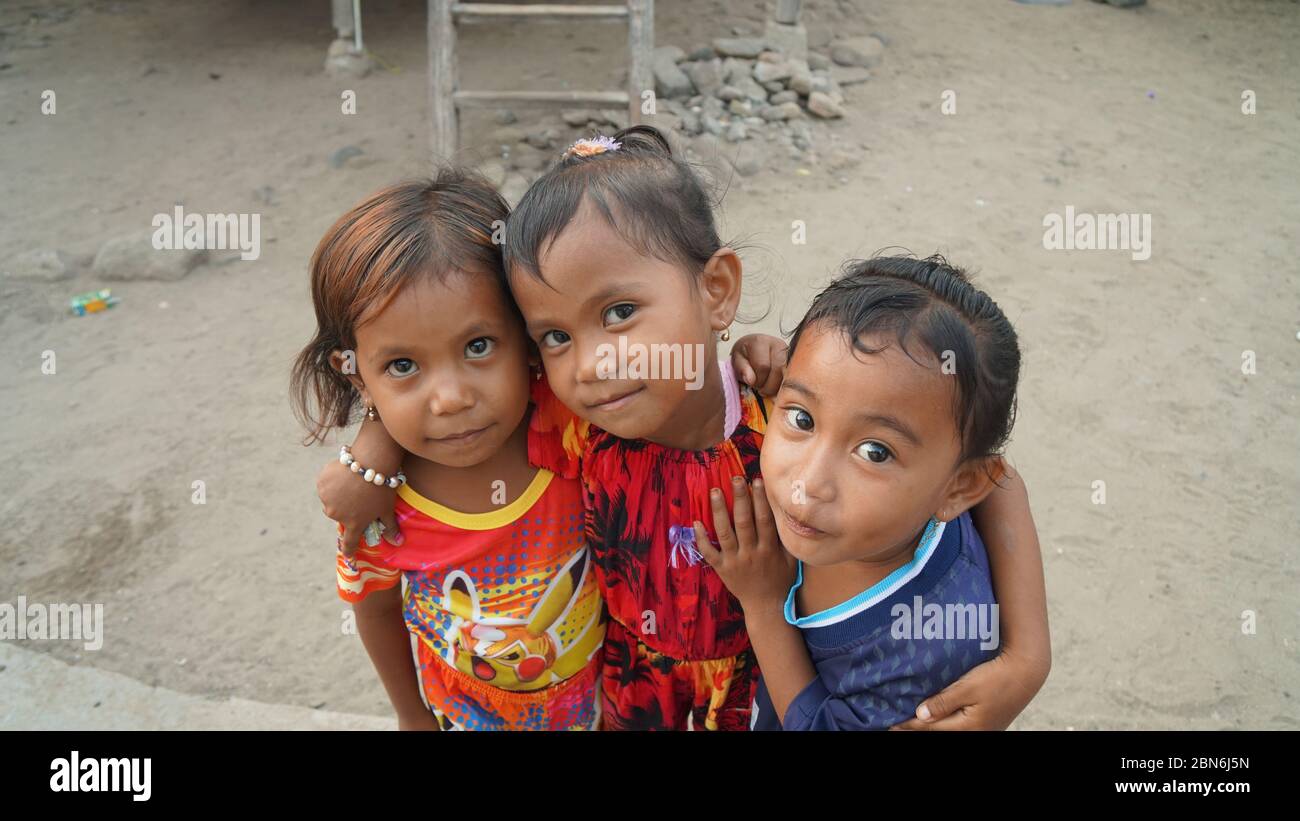 three young children at Comodo Island, Indonesia Stock Photo - Alamy